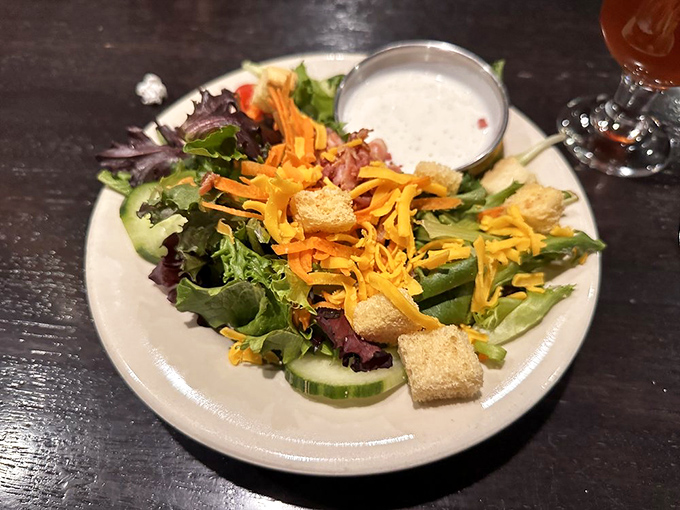 Even their house salad gets the royal treatment—crisp greens, vibrant vegetables, thoughtfully proportioned toppings. It's the overachiever of the side dish world.