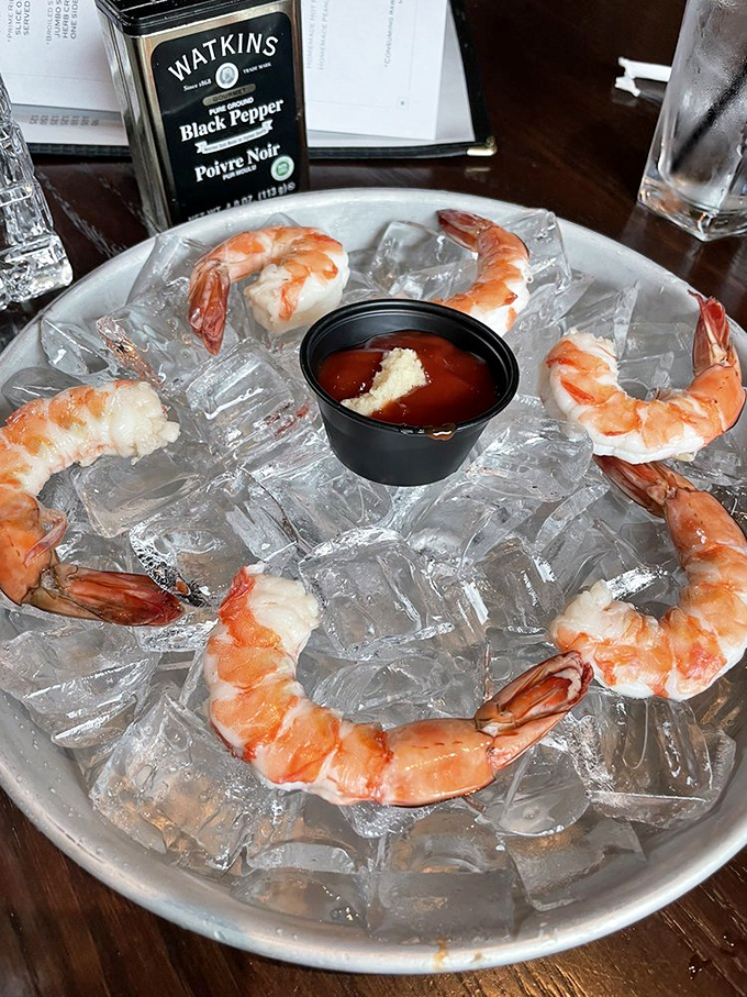 Shrimp cocktail served on ice—like a seafood jewelry display where you're encouraged to eat the diamonds. Pure oceanic luxury.