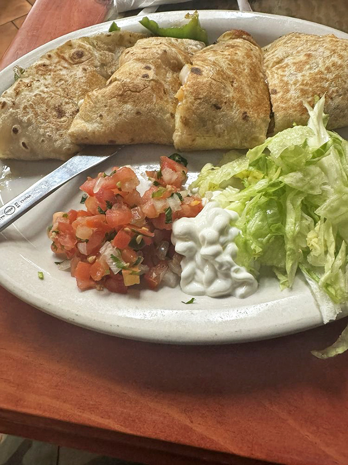 Shrimp quesadillas that would make even seafood skeptics reconsider their life choices. The char marks tell you everything you need to know.