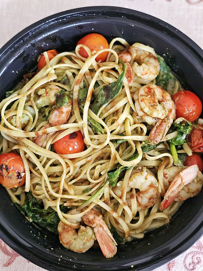 Plump shrimp nestled among linguine strands like treasures waiting to be discovered. The cherry tomatoes add perfect pops of color and acid.