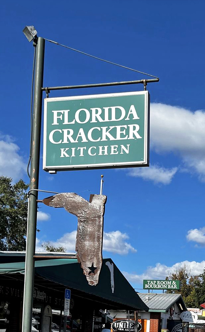 The sign promises "Florida Cracker Kitchen" while the metal state cutout below silently adds, "Yes, we're serious about our Florida heritage."