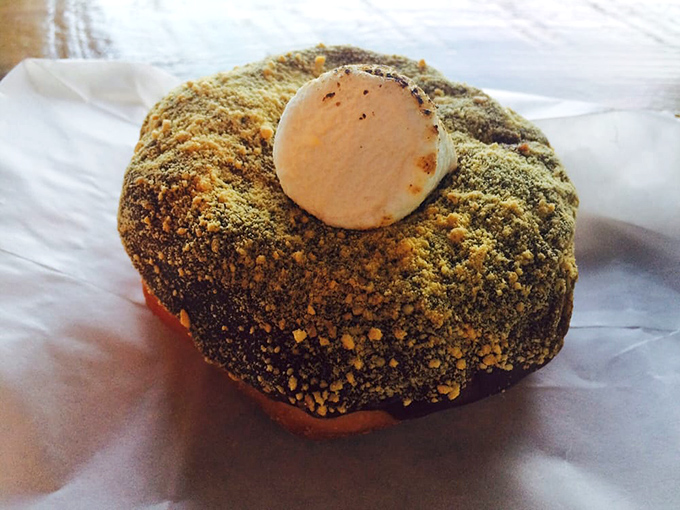 The s'more donut brings campfire nostalgia without the mosquitoes&mdash;graham cracker crumbs and marshmallow creating childhood memories with adult-level execution.