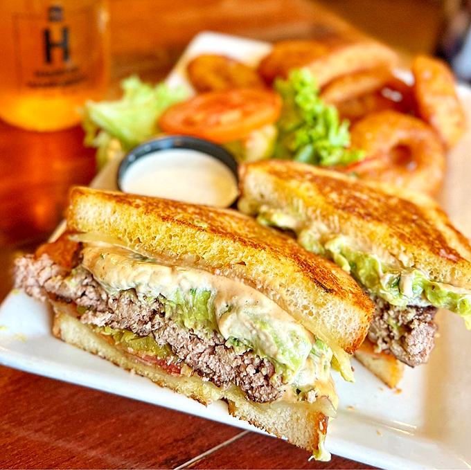 The Southwest Sourdough Burger doesn't just sit on the plate—it commands attention like a delicious edible monument to Arizona flavor.