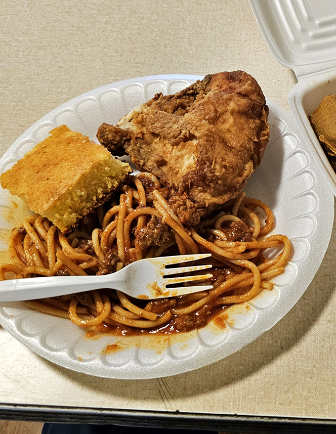 This plate is the United Nations of comfort food&mdash;spaghetti, fried chicken, and cornbread negotiating perfect harmony on a single plate.