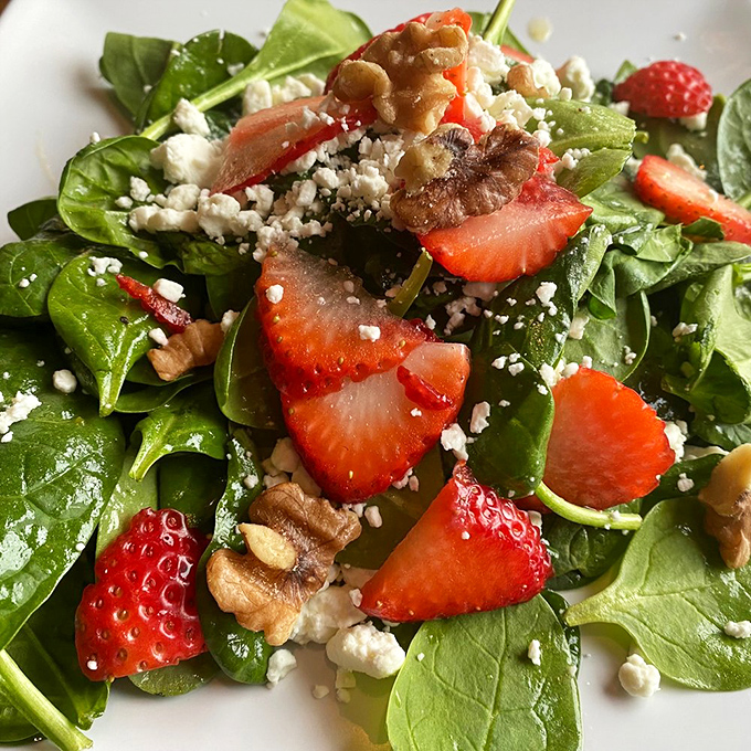 Not all heroes wear capes&mdash;this spinach salad wears strawberries, goat cheese, and walnuts while rescuing lunch from boring alternatives everywhere.