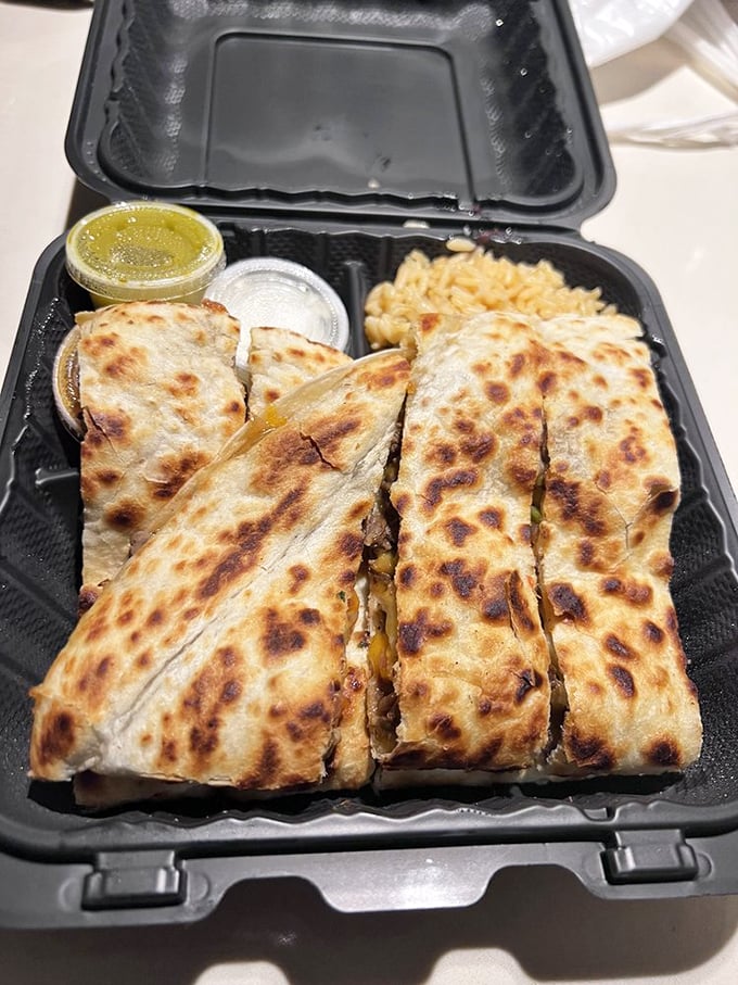 This quesadilla has achieved the impossible trifecta: perfectly melted cheese, expertly seasoned filling, and that golden-brown exterior that dreams are made of.