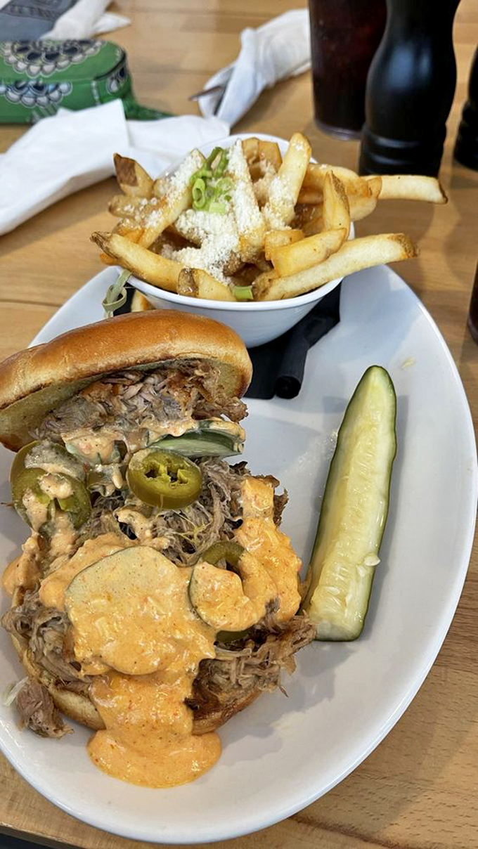 The Adams arrives with enough pulled pork to make a Southern grandma nod in approval. That sauce isn't just orange &ndash; it's liquid ambition.