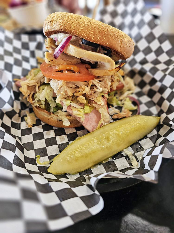 This towering creation makes you wonder if sandwiches have their own skyline competitions. The Empire State of lunch options.