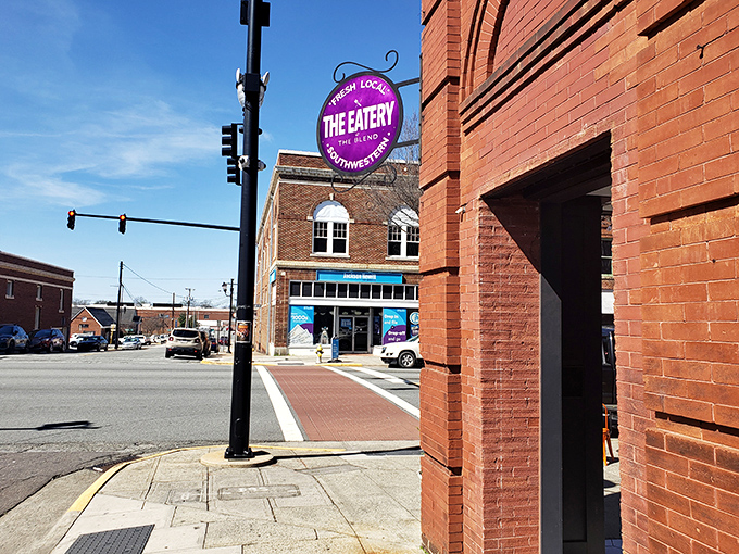 The Eatery's colorful presence adds vibrant energy to Lexington's historic downtown, like a modern note in a traditional barbecue symphony.