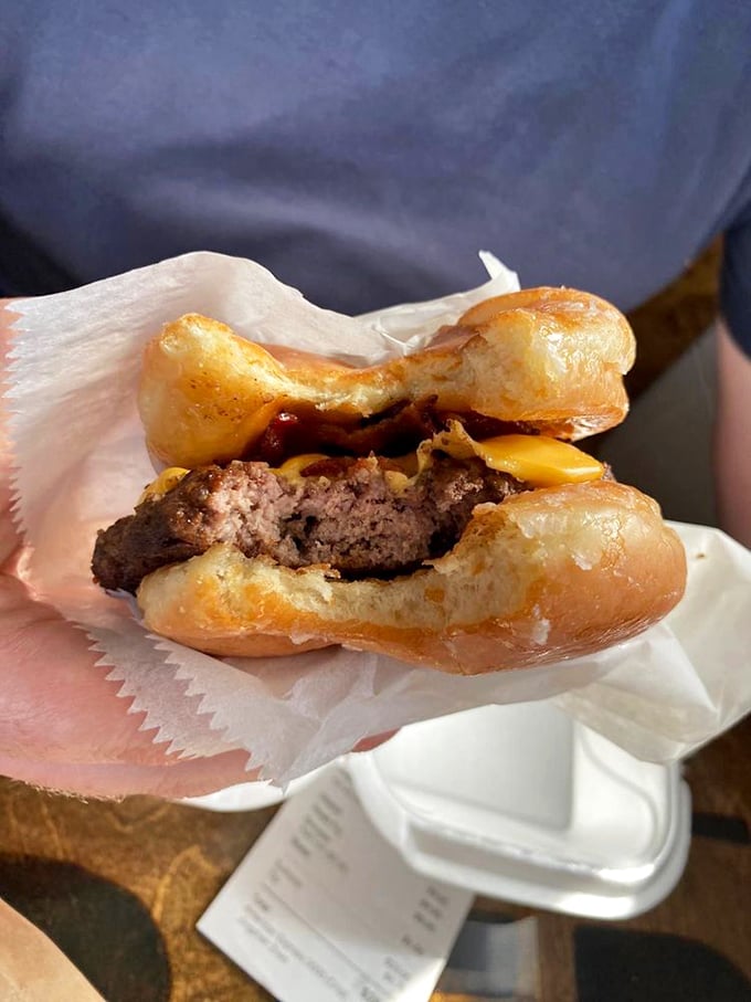 The infamous donut burger in mid-bite reveals its sweet-savory secrets. Your cardiologist just felt a disturbance in the Force.