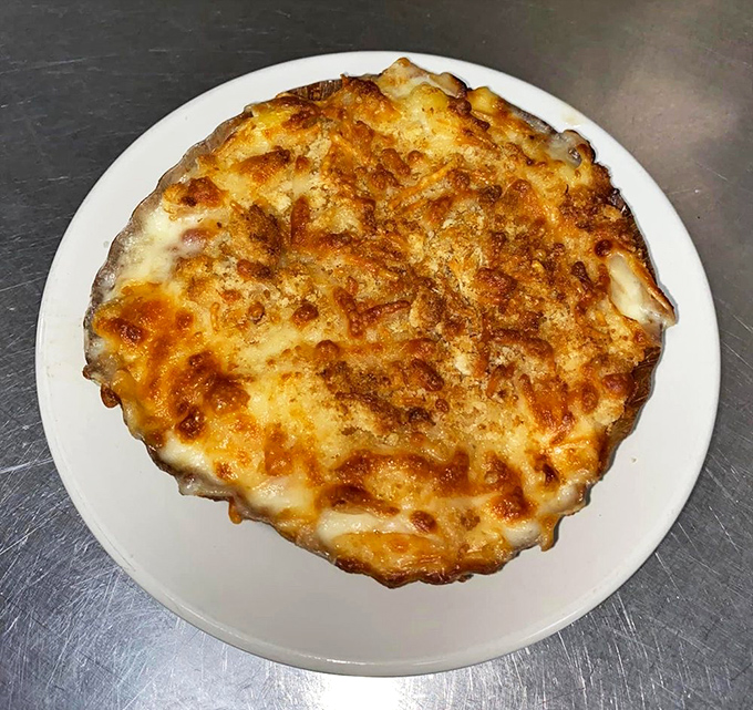 White cheddar mac and cheese that inspires poetry. This isn't your childhood boxed version&mdash;unless your mother was secretly a gourmet chef.