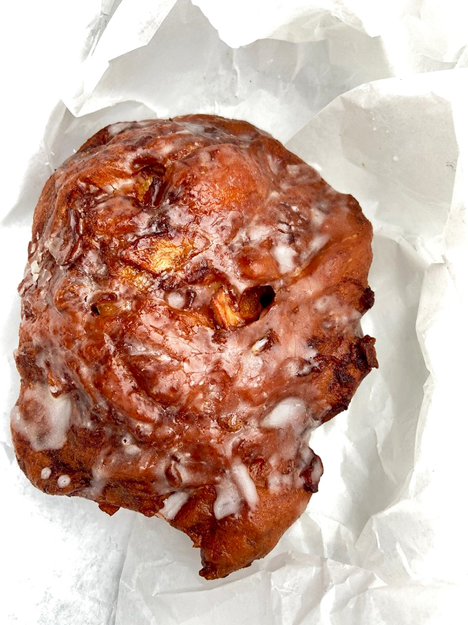 The Michelangelo of apple fritters has struck again! Glazed, glistening, and approximately the size of a small planet&mdash;breakfast perfection exists.