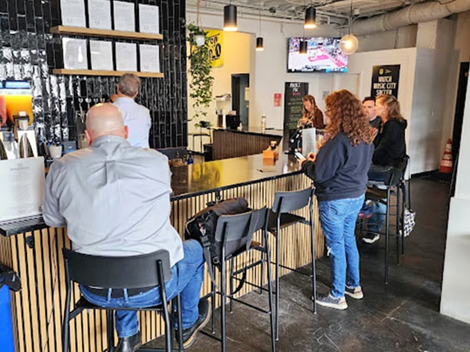 The bustling bar area where decisions are made, friendships are formed, and beer philosophies are debated with passionate intensity.
