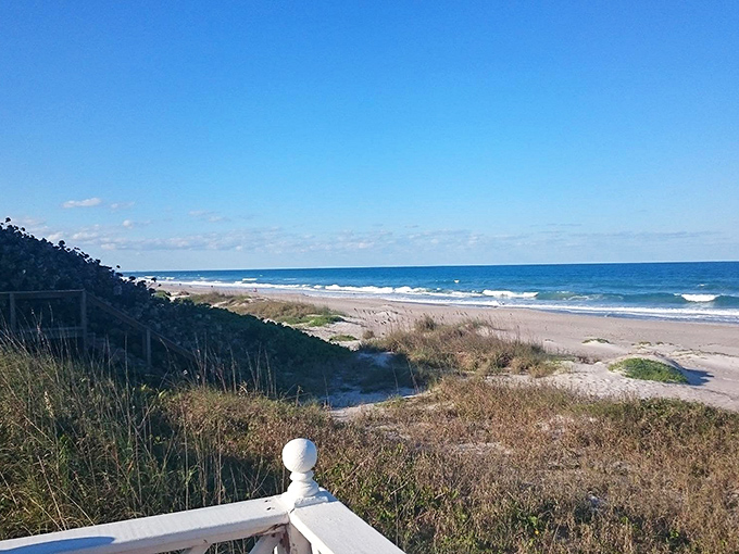 This isn't just any beach view&mdash;it's the promise of endless horizon therapy, where sea oats dance in the breeze and footprints become temporary art.