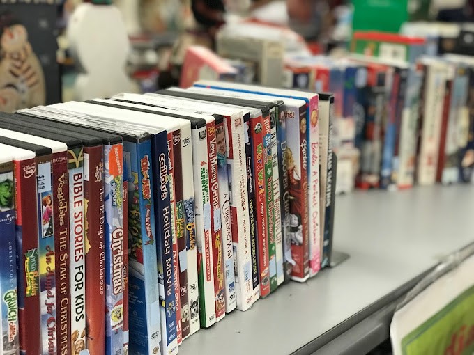 The DVD aisle—a time capsule of movie nights past, where forgotten classics and guilty pleasures wait for their encore presentation in your living room.