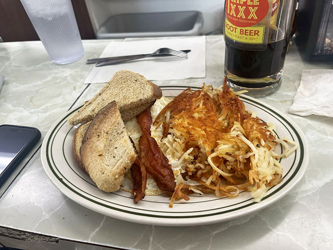 Morning glory on a plate. Crispy hash browns, perfectly toasted bread, and bacon that makes you wonder why we bother with other breakfast meats.