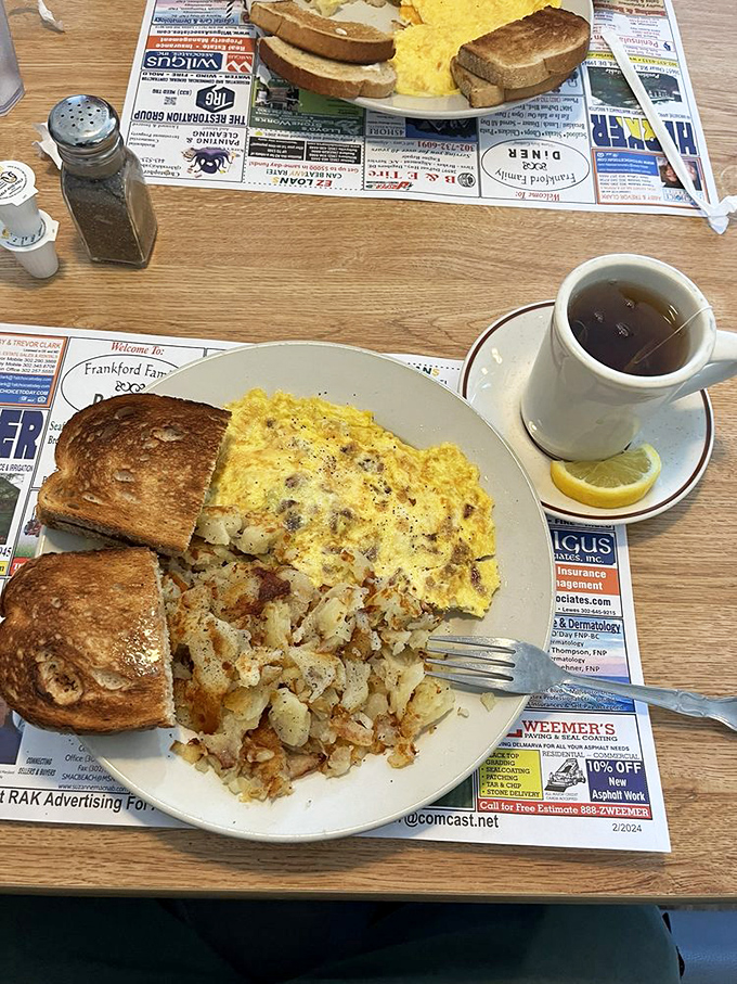 The classic breakfast platter that's fueled American ambitions for generations, served on placemats featuring local businesses&mdash;community in every bite.