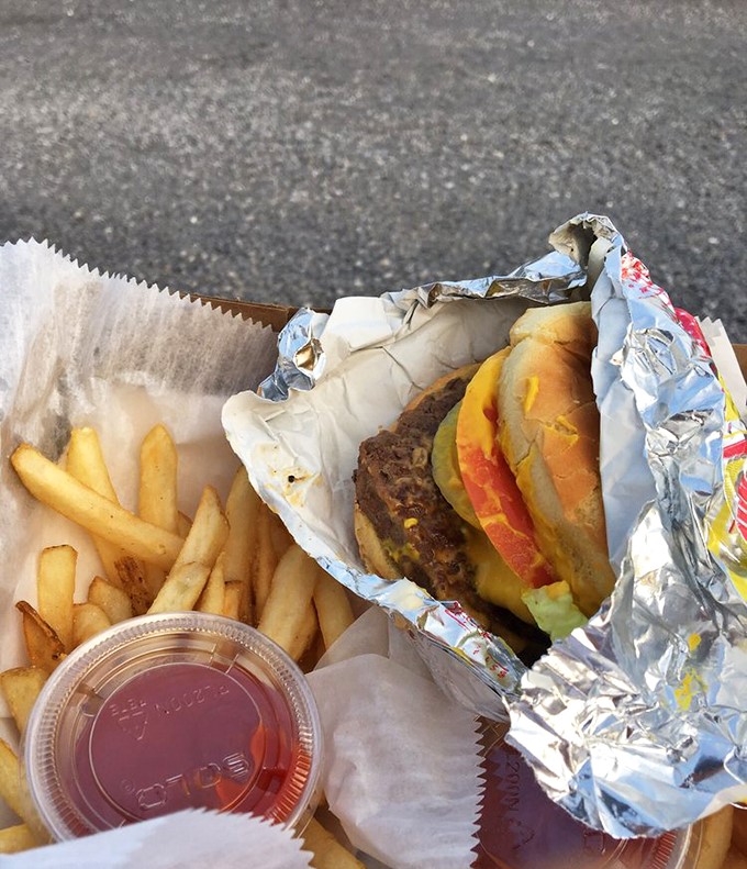 Drive-in deluxe: a juicy burger and crispy fries that somehow taste better when eaten with a movie soundtrack.