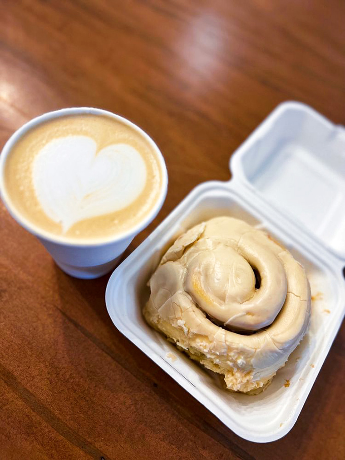 The perfect breakfast duet&mdash;a heart-topped latte serenading a cinnamon roll. Together they make mornings bearable, even magnificent.