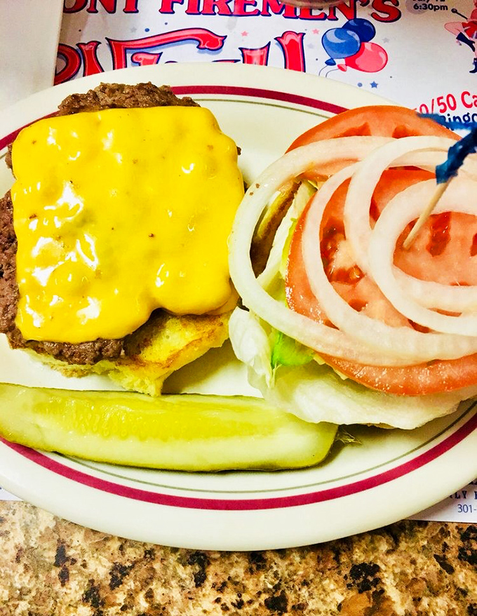 A cheeseburger that doesn't need fancy aioli or artisanal buns to make its point. Just honest ingredients stacked with American optimism.