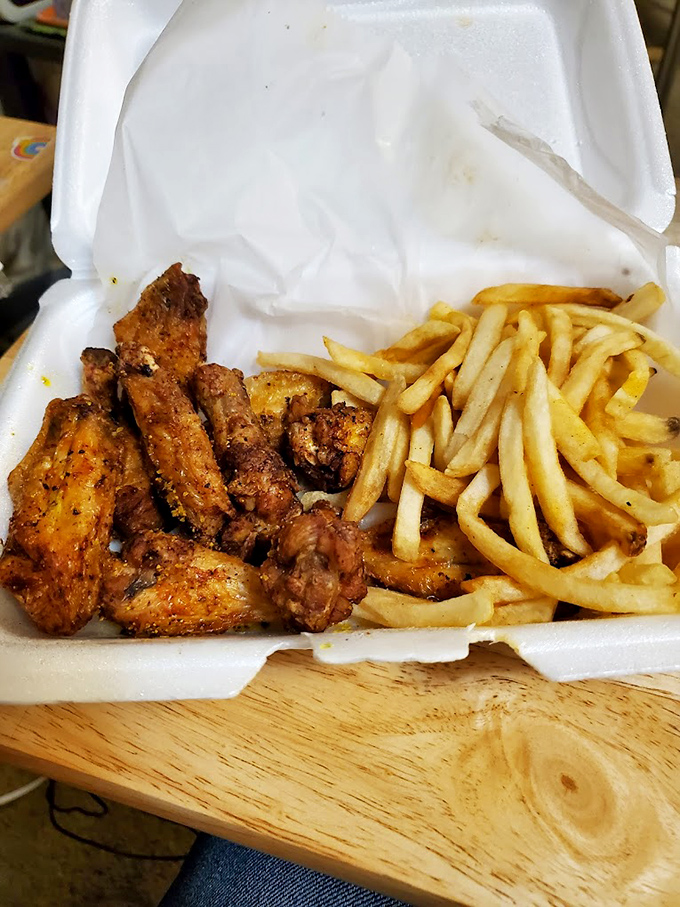 Wings that make you question why anyone would ever eat them any other way. Those fries aren't just side characters&mdash;they're essential sauce-delivery vehicles.