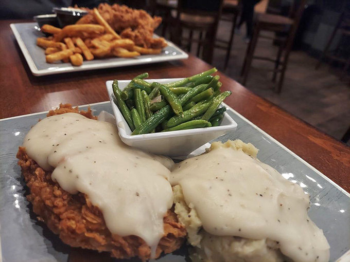 This chicken dish, smothered in creamy sauce alongside perfectly cooked green beans, is what comfort food dreams are made of.