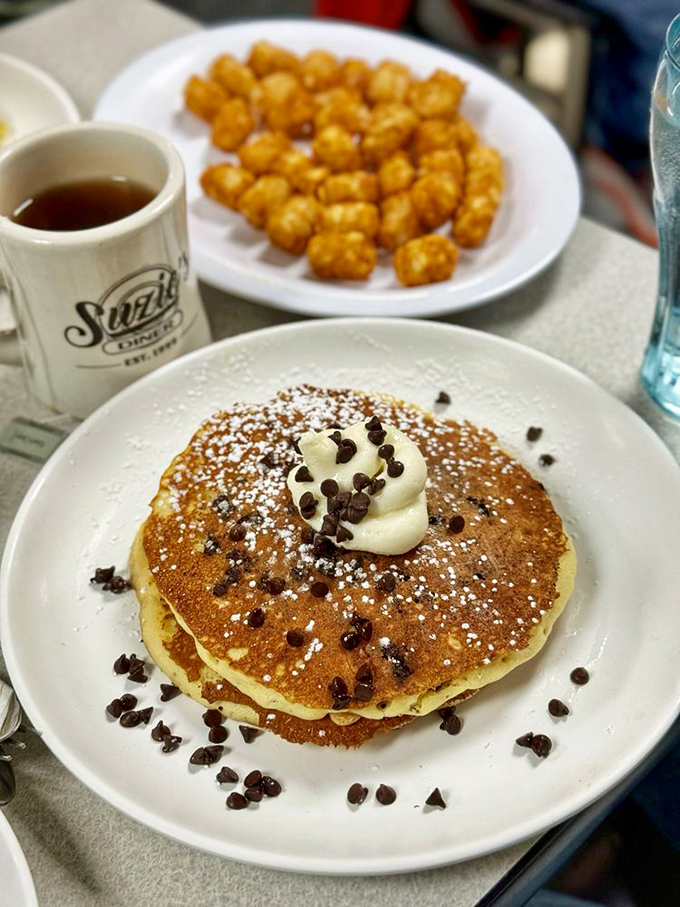A chocolate chip pancake that could make even the grumpiest morning person smile, with tater tots playing the perfect supporting role.