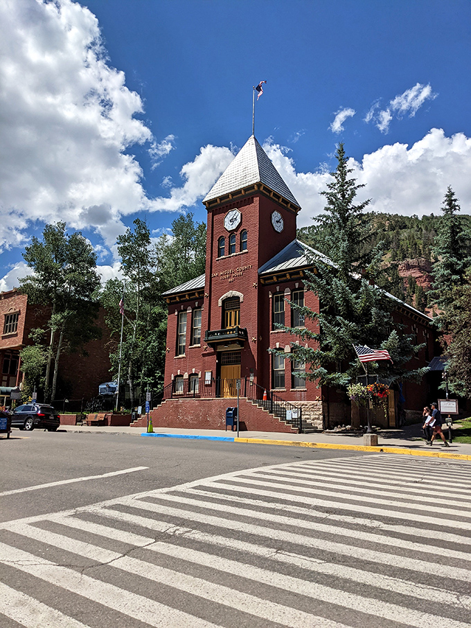 Justice with a view&mdash;Telluride's courthouse stands sentinel over Colorado Avenue. Victorian brick architecture meets mountain majesty in perfect civic harmony.