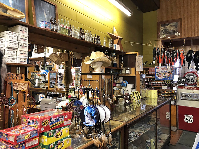 Nothing says "I've gone full tourist" quite like trying on a genuine cowboy hat while surrounded by enough Route 66 merchandise to fill a museum.