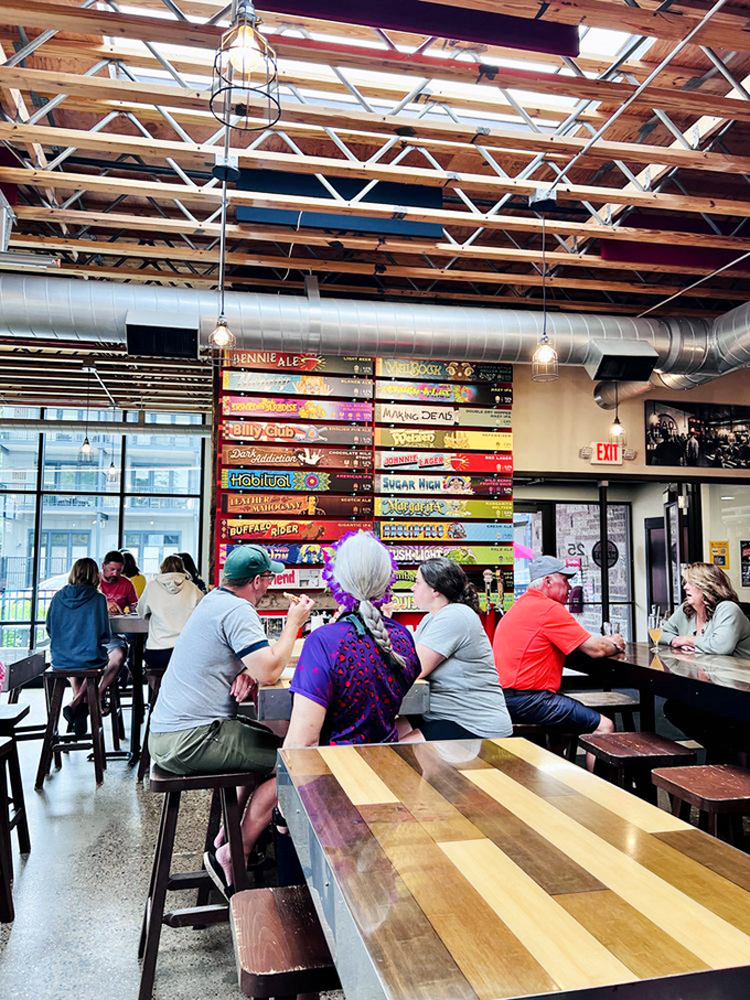 Where strangers become friends and friends become family. The colorful tap wall serves as both menu and conversation starter.