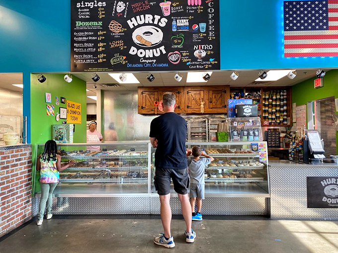The moment of decision arrives. Parents and children alike stand transfixed by the glass barrier between desire and fulfillment&mdash;a sweet family bonding experience.