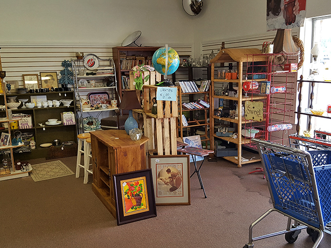 Vintage furniture and framed art create a time capsule effect. That wooden desk has probably seen more homework than an overworked teacher.