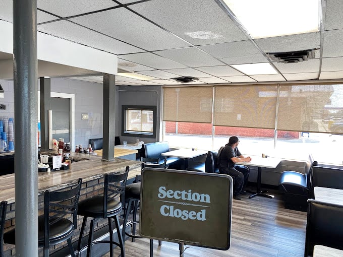 A dining area that whispers "take your time" while somehow serving everyone efficiently&mdash;the magic of a well-run pancake house.