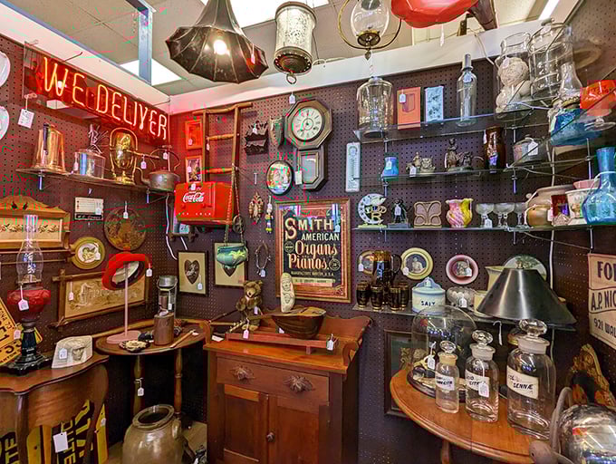 A neon "We Deliver" sign illuminates a collection of vintage pharmacy bottles and kitchen gadgets. Your grandmother would recognize every item here&mdash;and have stories about each one.