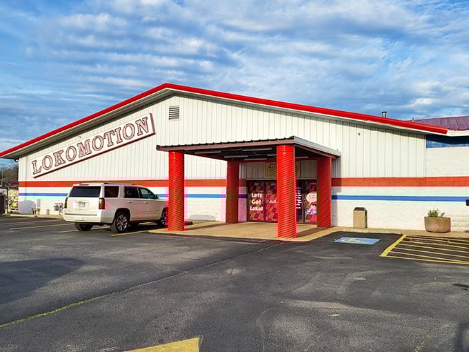 The classic red, white, and blue exterior stands like a temple to fun. Even the parking lot seems to whisper, "Adventure awaits inside."