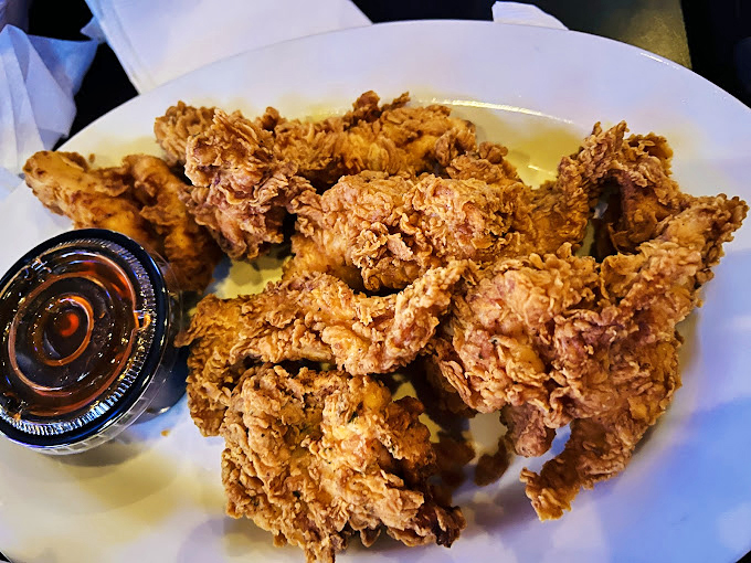 Fried chicken that crackles with each bite – golden armor protecting juicy treasure within, served with liquid gold dipping sauce.