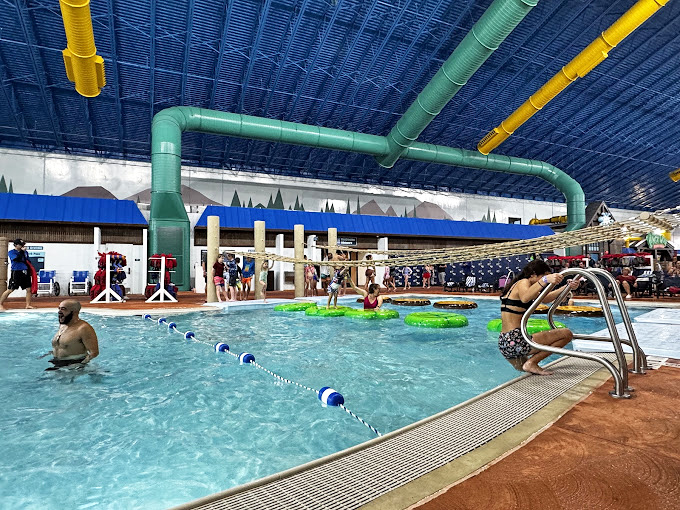 Twisted slide heaven! Engineering marvels in yellow, green and blue deliver equal parts adrenaline and chlorine-scented joy to thrill-seekers of all ages. 