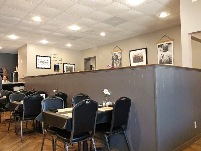 The dining area's simple elegance says, "We put our energy into the food, not fancy decorations." Those black-and-white photos on the wall tell stories of Claremore's past.