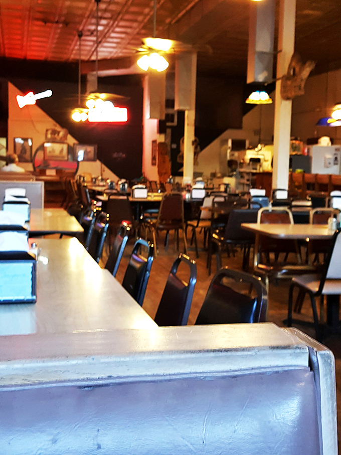 The interior speaks volumes: taxidermy trophies stand guard over the bar, silently approving your excellent dining choices. 