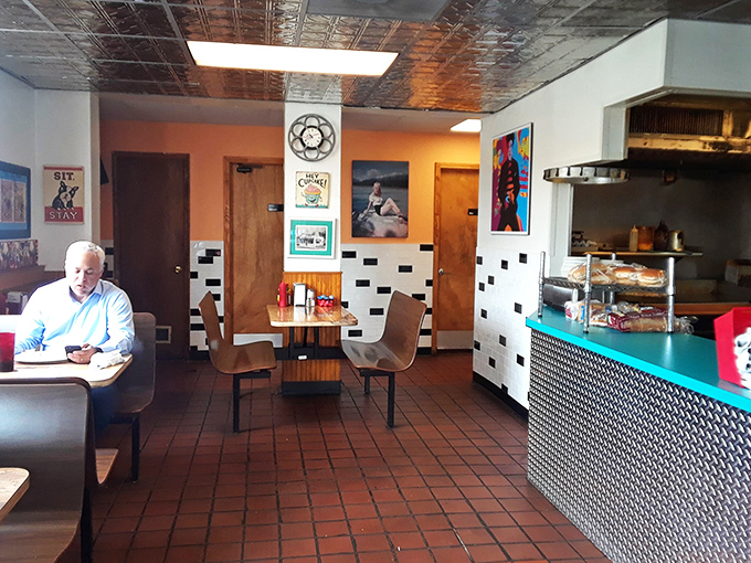 The dining room balances nostalgia with comfort. Vintage signs and classic diner elements create an atmosphere where you instantly feel like a regular, even on your first visit.