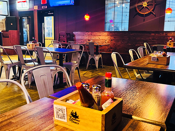 Rustic wood, nautical touches, and condiment caddies ready for action. This dining room feels like the galley of a particularly stylish fishing vessel.