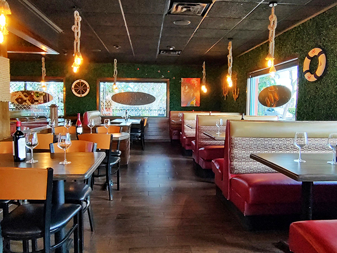 The hanging lights cast a warm glow over wooden tables and green accents, creating the perfect backdrop for seafood-induced happiness.