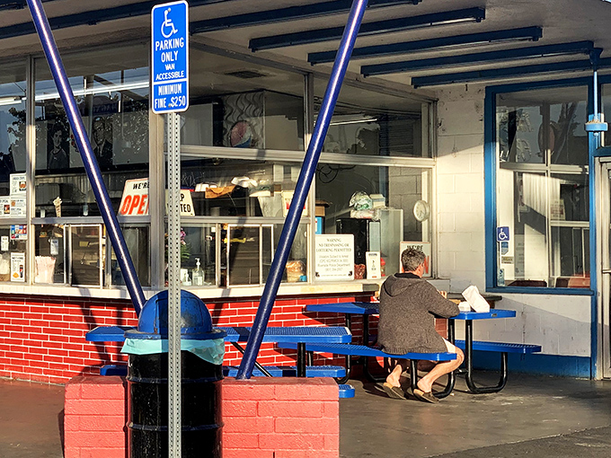 Morning sunshine streams through the windows as a lone diner enjoys the simple pleasure of a meal without the interruption of Instagram.