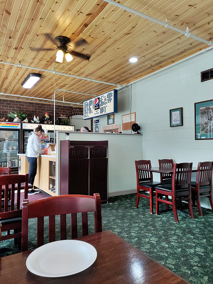 The ordering counter stands ready for the day's chicken pilgrims, with the wooden ceiling adding warmth to this temple of comfort food.