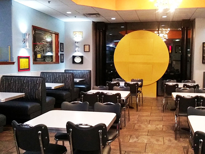 Mid-century modern meets comfort in this dining room where the starburst chandeliers have witnessed countless late-night confessions.
