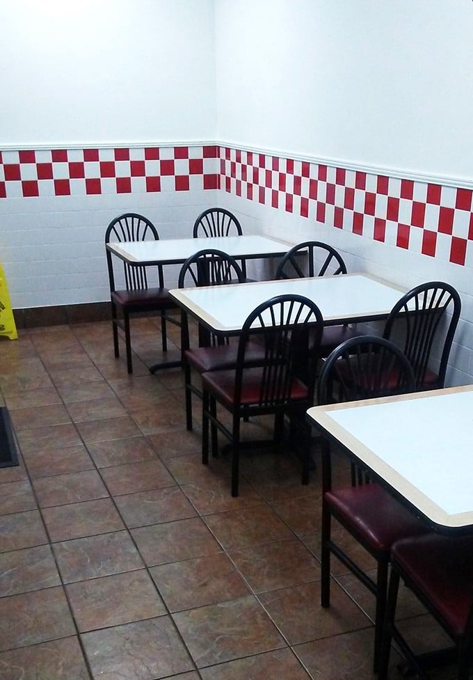 The dining area's checkerboard trim and simple furnishings say, "We put our energy into the food, not into impressing interior designers."