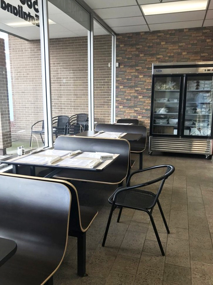 The dining area might be modest, but those refrigerated cases hold treasures more valuable than gold: fresh, handmade pasta.