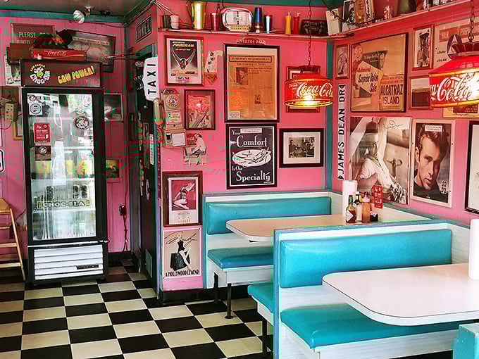 Pink walls adorned with vintage treasures and Coca-Cola signs create the perfect backdrop for turquoise booths. Nostalgia never tasted so good.