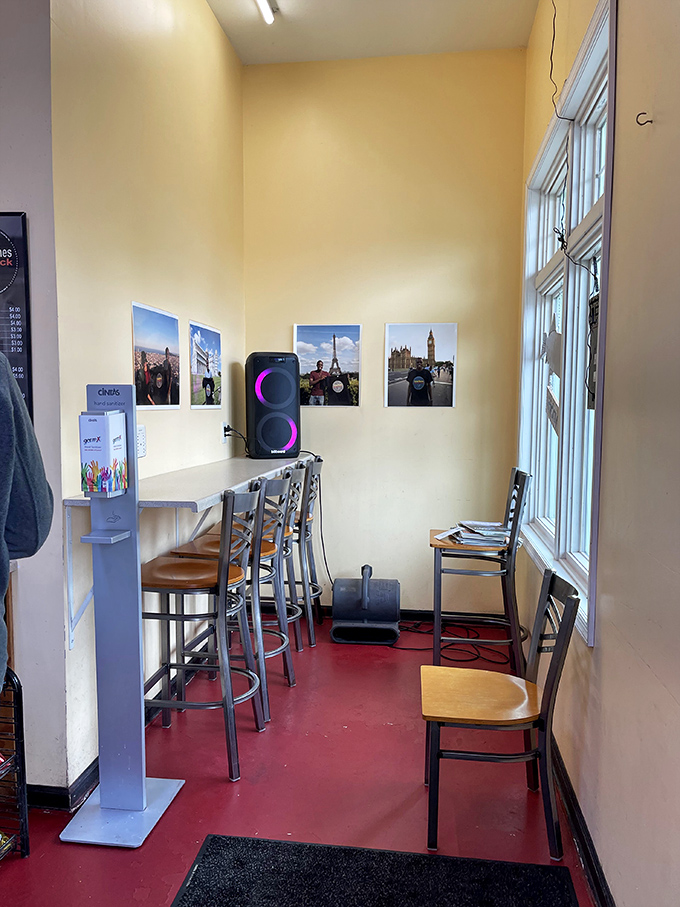 The dining area might be small, but those travel photos on the wall remind you that great food transcends space. Barbecue diplomacy at its finest.