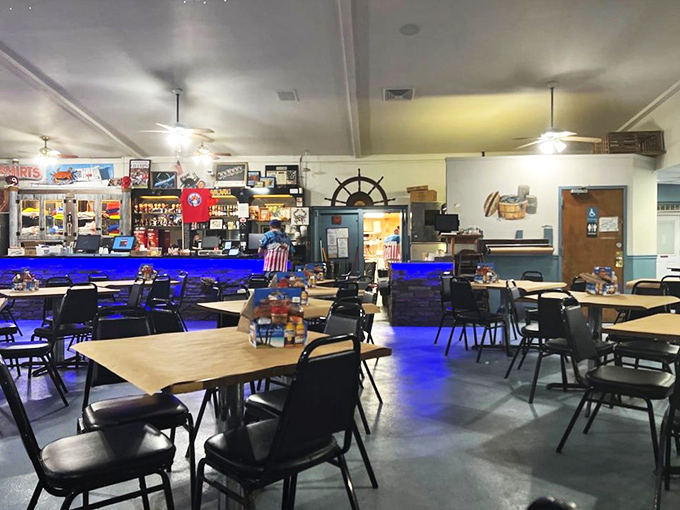 The dining room glows with blue light like an underwater kingdom where the currency is crab and everyone leaves richer.